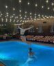 Aquabatix synchronised swimmers perform at rooftop pool party